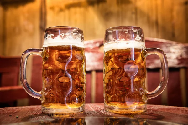 two beer mugs at the bar - Stock Image - Everypixel