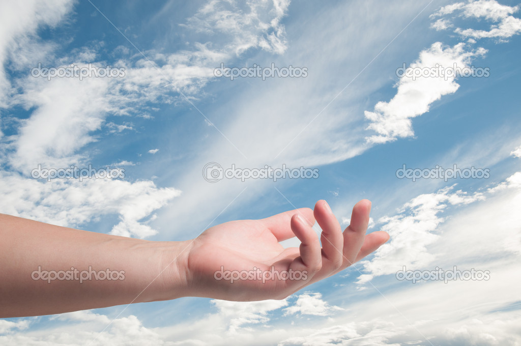 Hand Holding in sky background Stock Photo by ©CDPIC 33321741