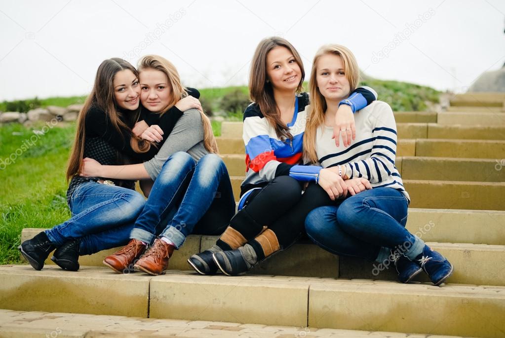 Four happy teen girls friends having fun outdoors Stock Photo by ... Four happy teen girls friends having fun outdoors Stock Photo by ...