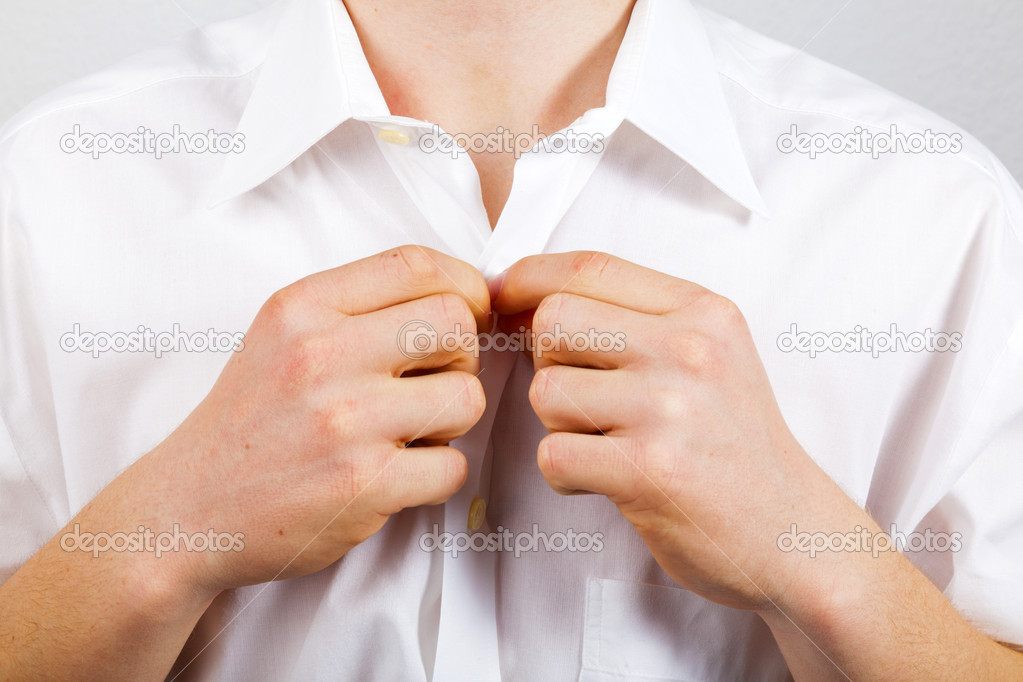 Buttoning a fresh, white shirt, on plain white background Stock Photo ...
