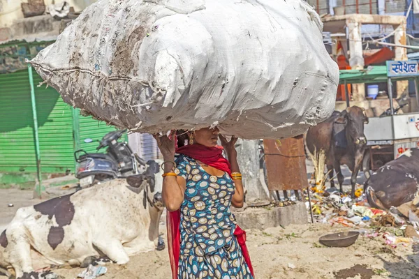 Woman Carrying Heavy Load