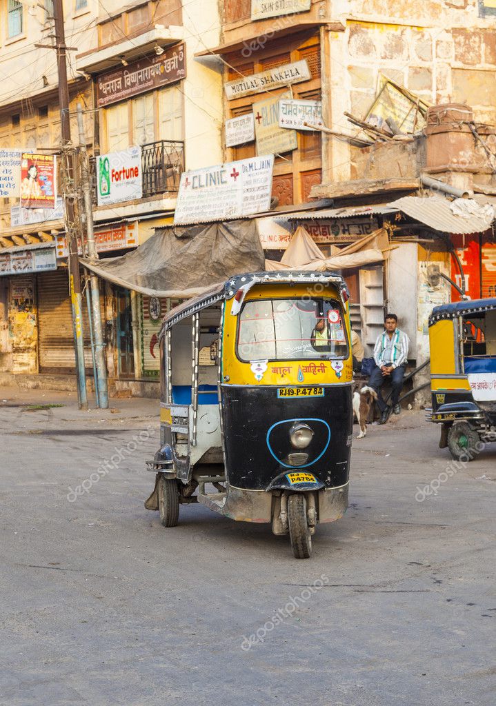 Auto rickshaw taxi driver with passengers in operation – Stock ...