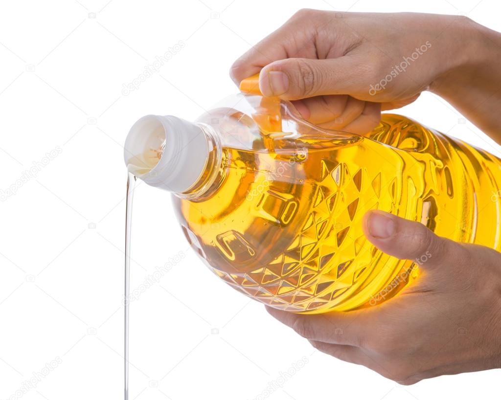 Female Hands Pouring Vegetable Oil — Stock Photo © akulamatiau #38555997