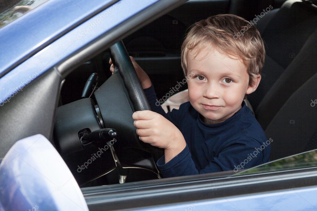 Boy driving a car Stock Photo by ©Photozirka 34275243