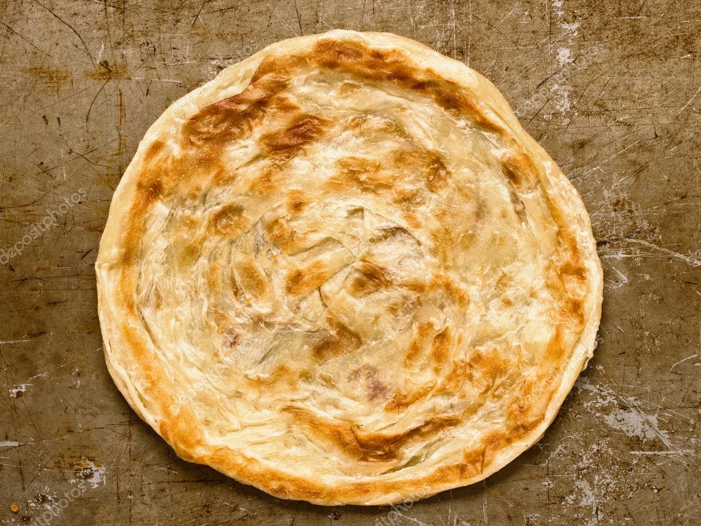Rustic indian roti prata Stock Photo by ©zkruger 49882759