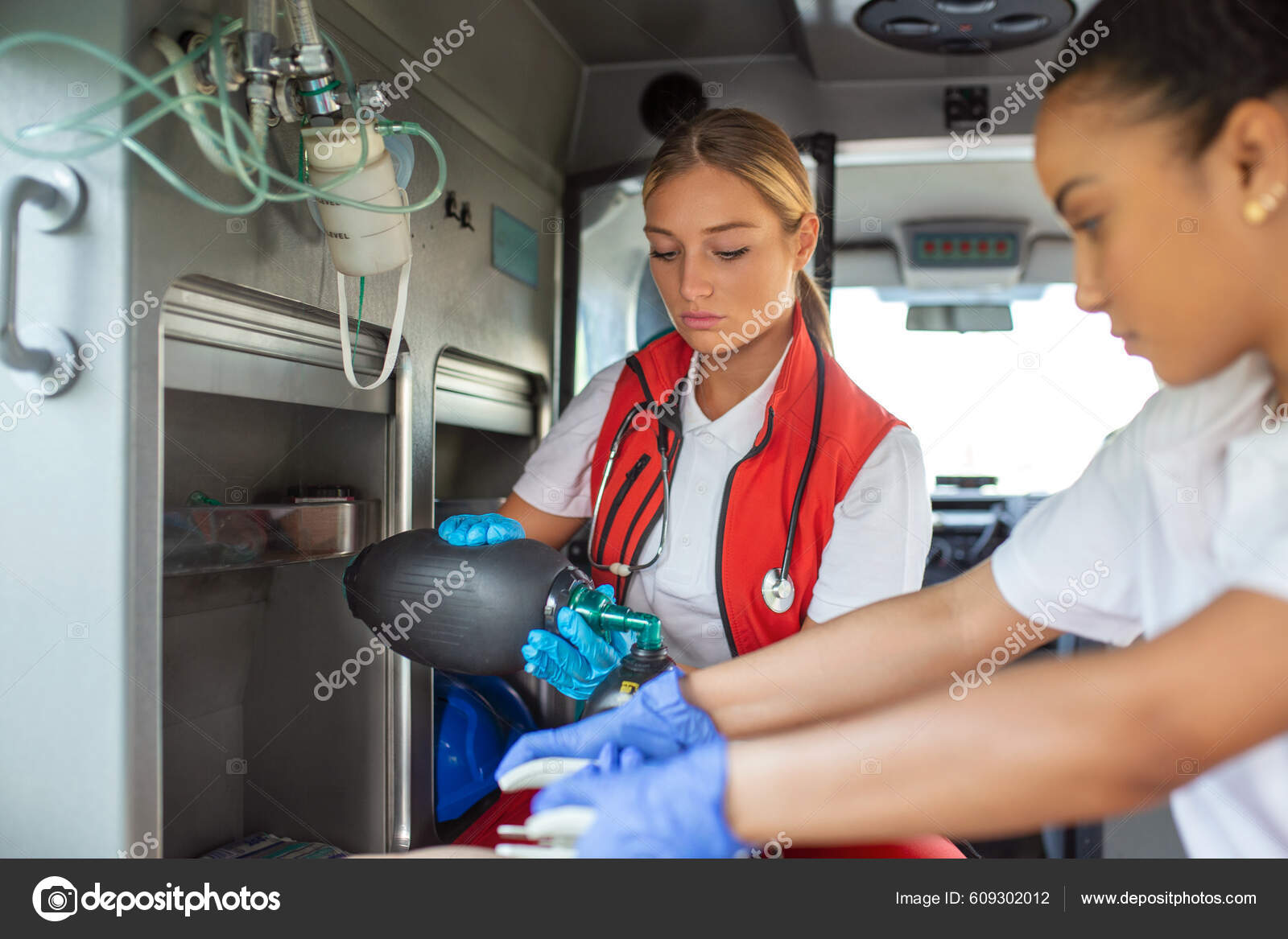 Paramedic Using Defibrillator Aed Conducting Basic Cardiopulmonary ...