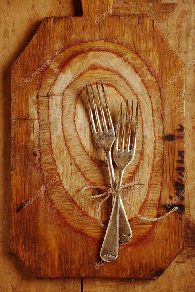 Two fork tied by string on old wood, background Stock Photo by ©lvenks ...