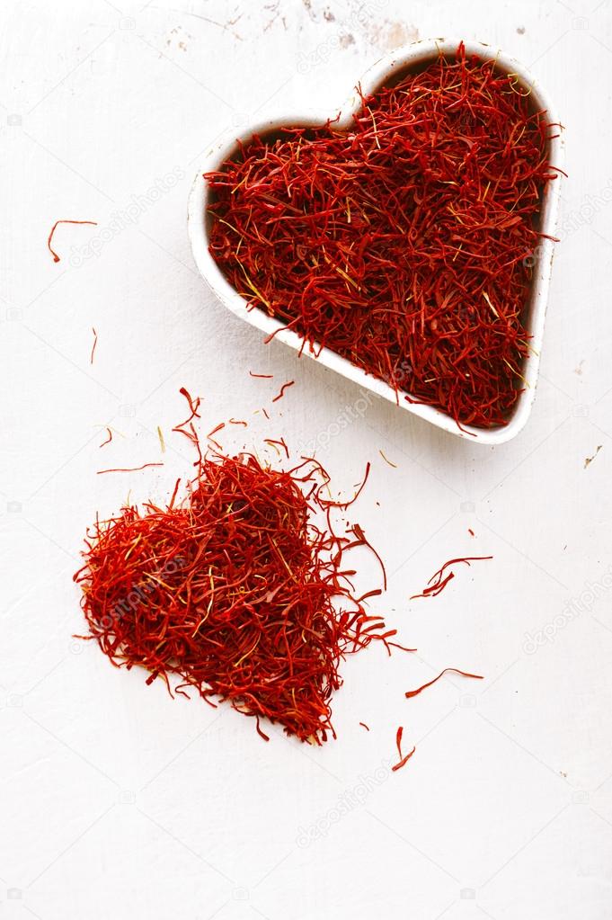 Moroccan saffron treads in pile, on white wood — Stock Photo © lvenks ...