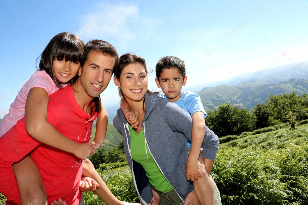 Parents and children standing in natural landscape — Stock Photo ...