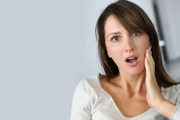 Woman with surprised expression on her face Stock Photo by ©Goodluz ...