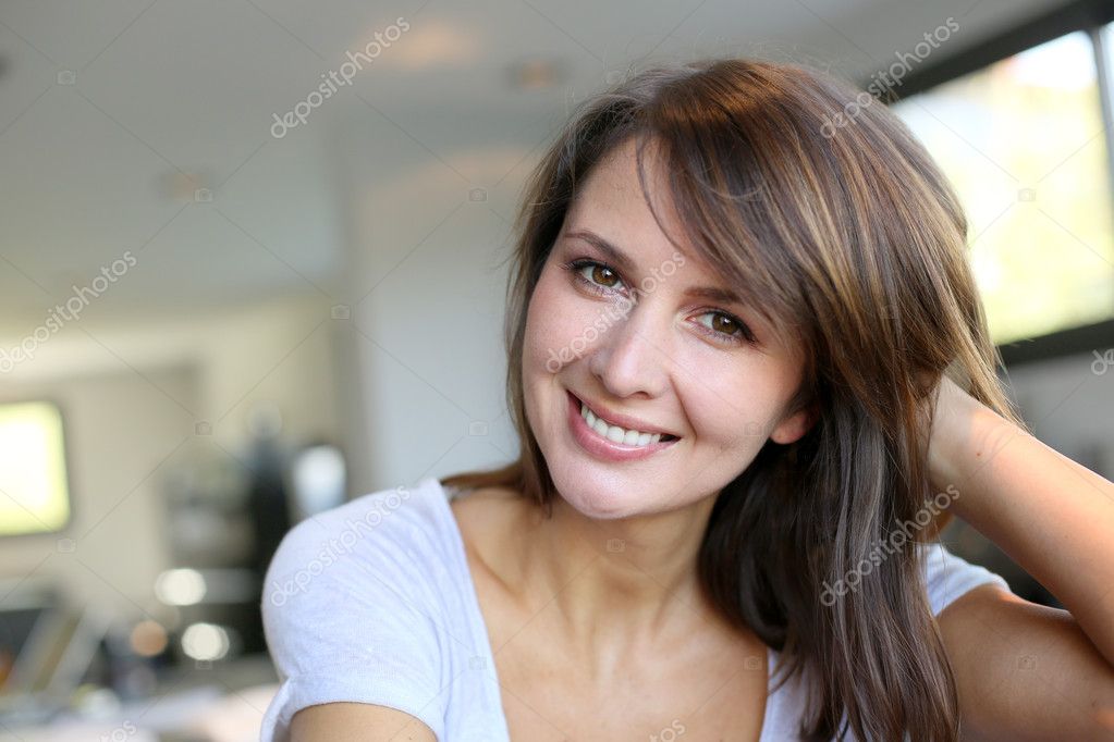 Portrait of beautiful woman looking at camera Stock Photo by ©Goodluz ...