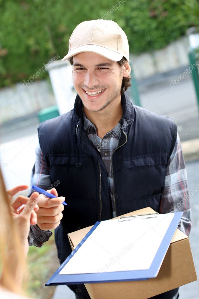 Portrait of smiling delivery man — Stock Photo © Goodluz #13965039