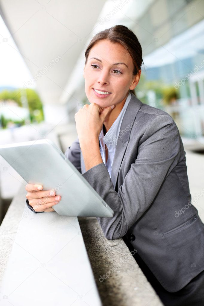 Executive woman standing outside with digital tablet Stock Photo by ... Executive woman standing outside with digital tablet Stock Photo by ...