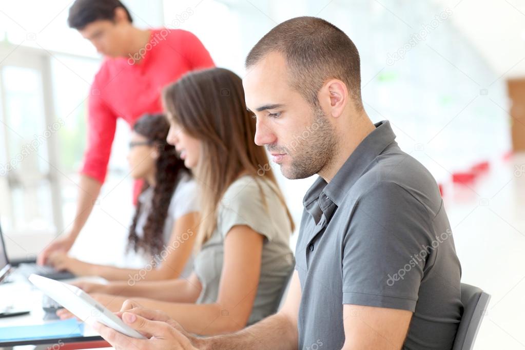 Group of young in training course Stock Photo by ©Goodluz 18206759