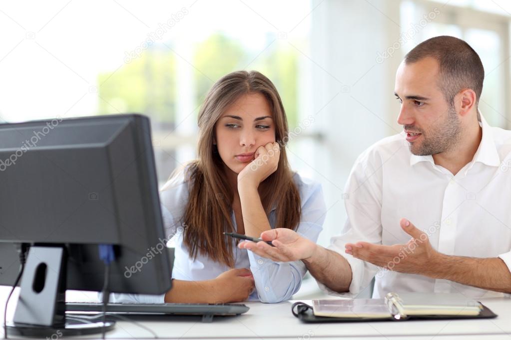 Office workers arguing on project — Stock Photo © Goodluz #18207467