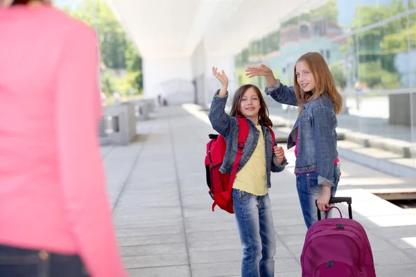 Group Of Kids Waving Goodbye