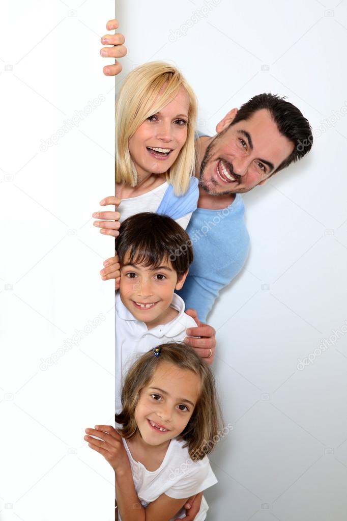 Happy family on white background Stock Photo by ©Goodluz 27880361