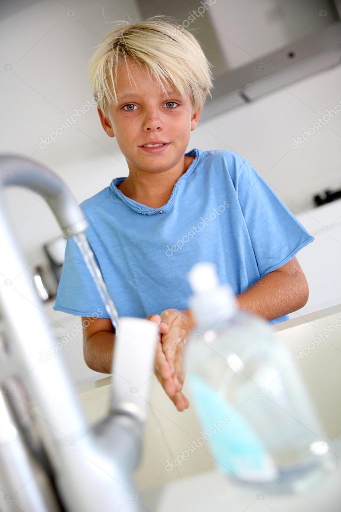 Young boy washing his hands Stock Photo by ©Goodluz 27917285