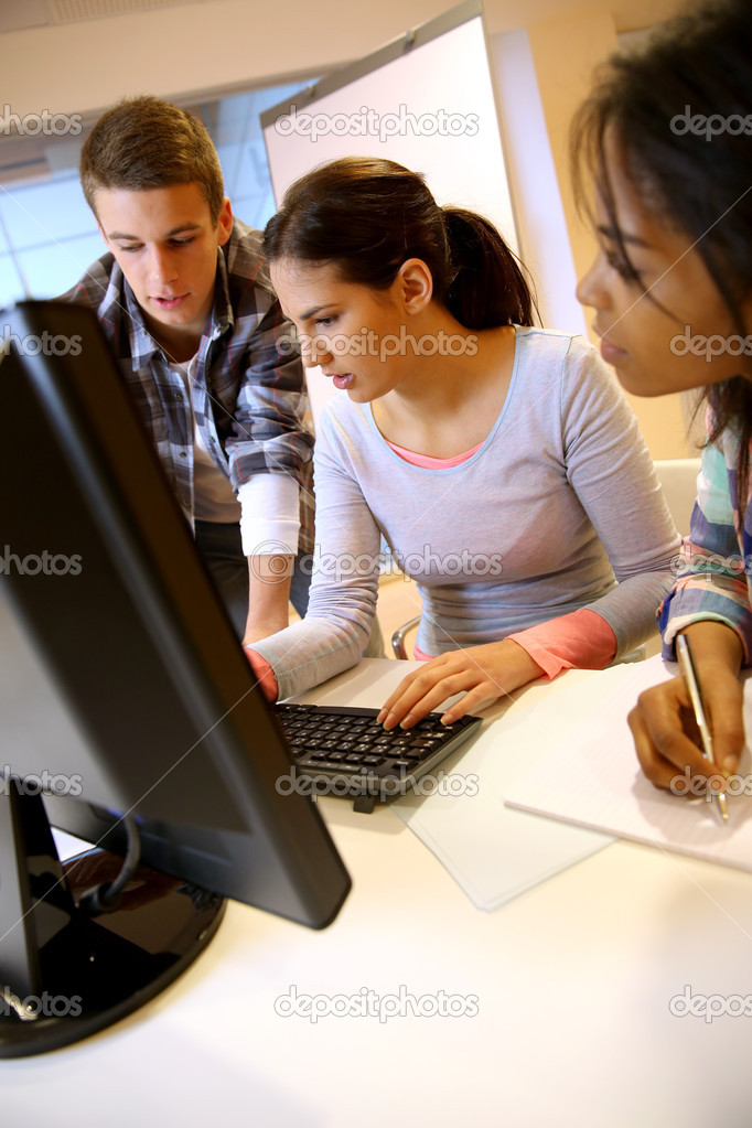 Group of students working in computer lab — Stock Photo © Goodluz #27927311
