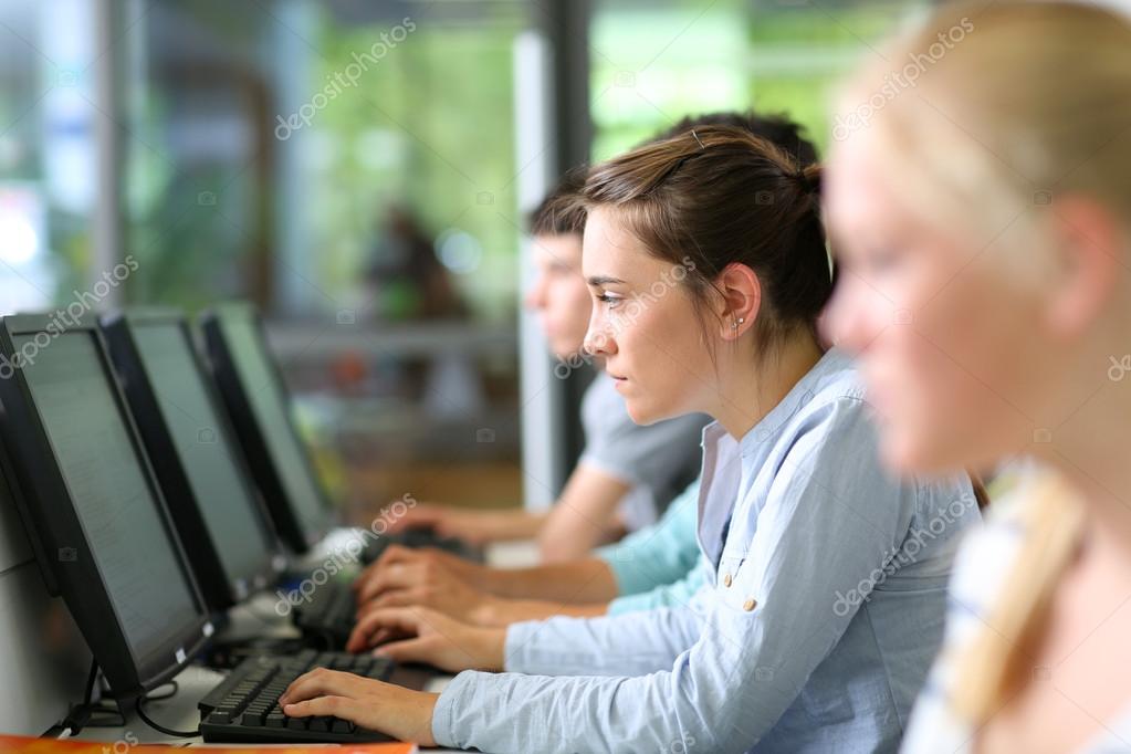 Students working on desktop computer — Stock Photo © Goodluz #35259965