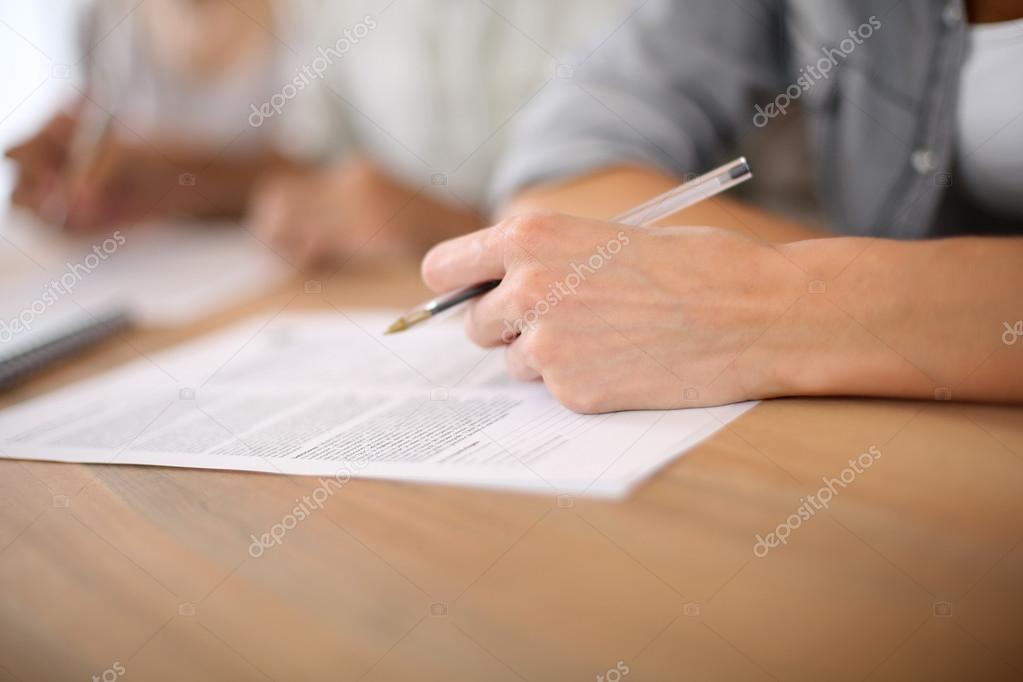 People filling admission form — Stock Photo © Goodluz #35311663