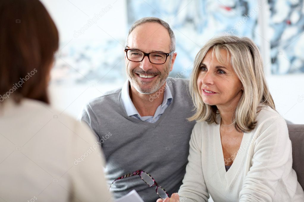Senior couple and financial adviser Stock Photo by ©Goodluz 36647991