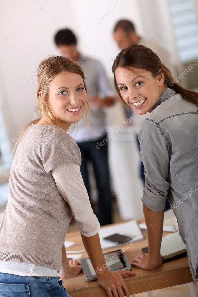 Student girls in company Stock Photo by ©Goodluz 36651833