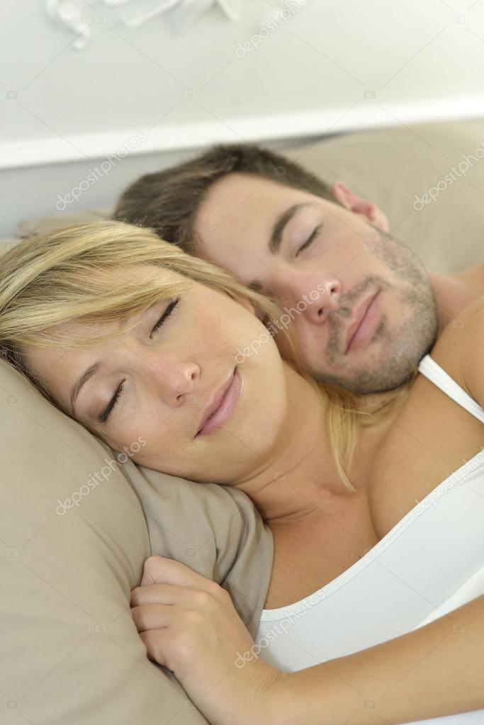 Sleeping couple in bed — Stock Photo © Goodluz #38967161