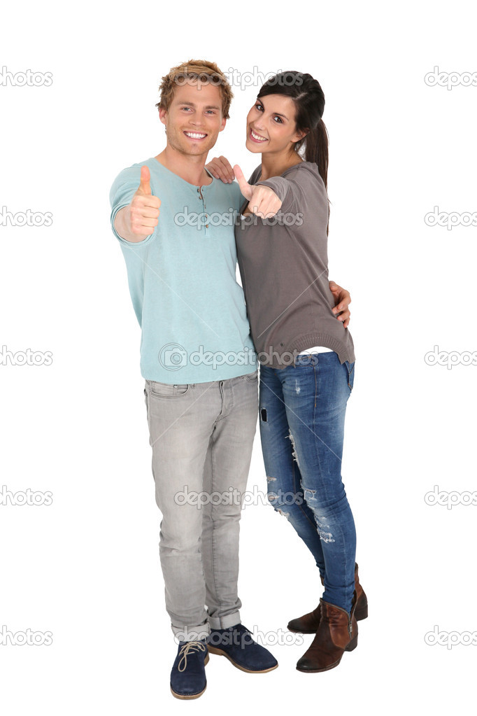 Couple showing thumbs up Stock Photo by ©Goodluz 43753703
