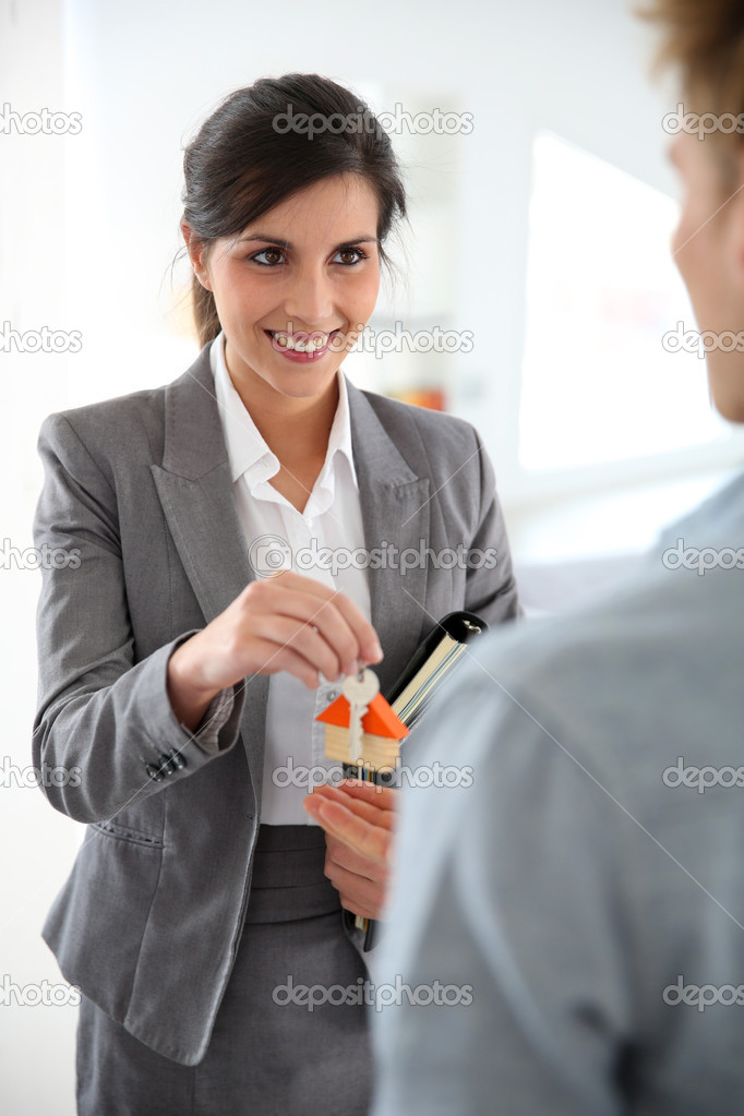 Smiling real-estate agent — Stock Photo © Goodluz #43754319