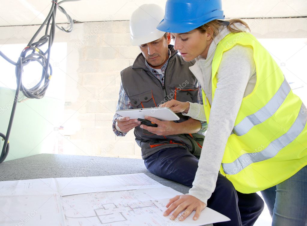 Engineers on building site — Stock Photo © Goodluz #47783205