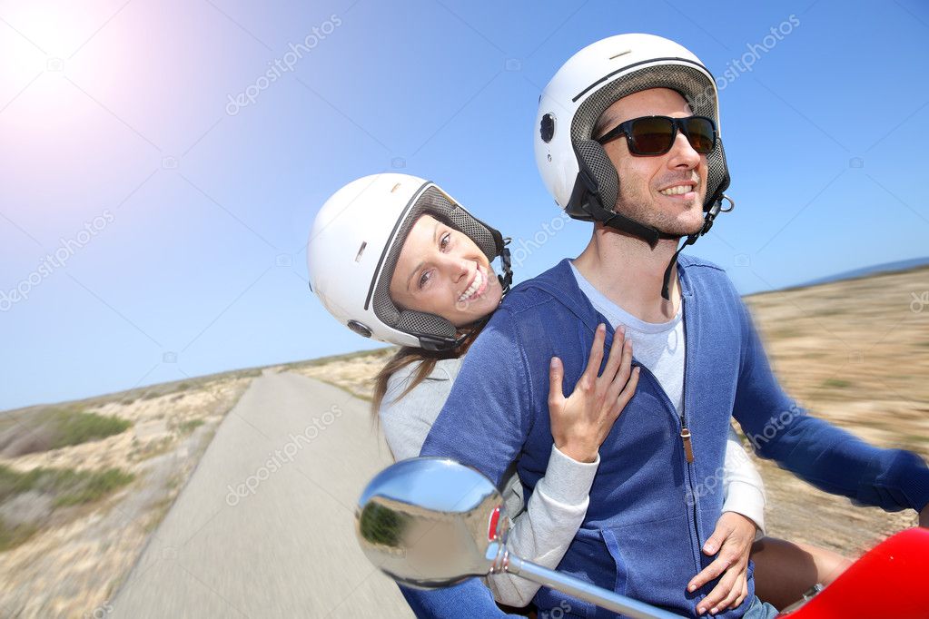 Couple riding motorcycle Stock Photo by ©Goodluz 47792319