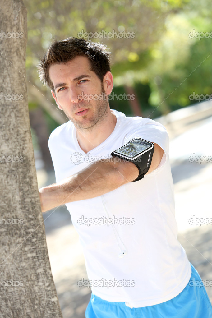 Man after running session Stock Photo by ©Goodluz 47817461