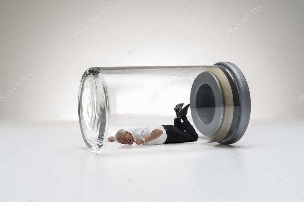 Senior man trapped in a glass jar — Stock Photo © MOELLERTHOMSEN #16920659