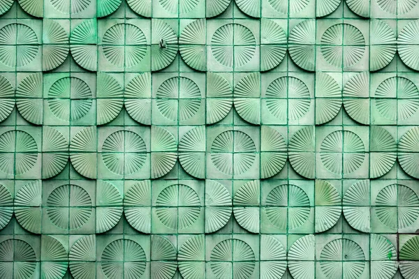 Mid-century modern style tiled wall with half circle decorations ...