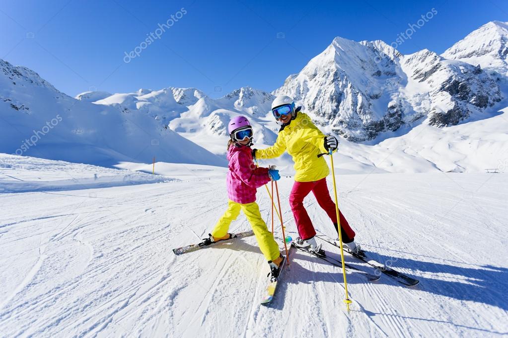 Skiing, skiers on ski run - child skiing downhill, ski lesson Stock ...