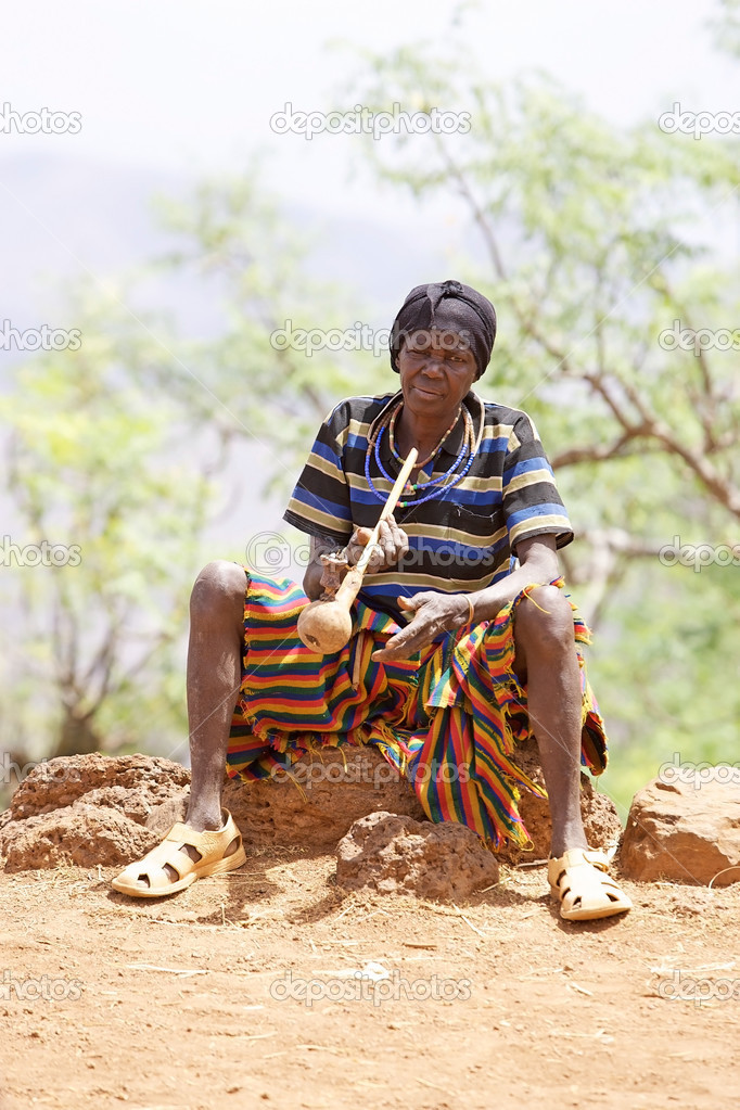 African Womn Is Smoking A Pipe Stock Editorial Photo © Ajlber 22793674