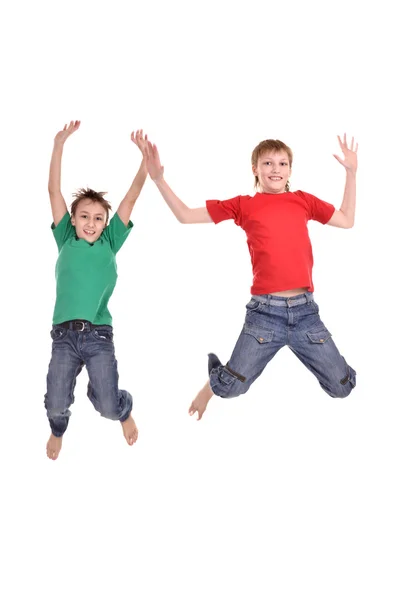 Two happy children jumping at once Stock Photo by ©Gelpi 9628514