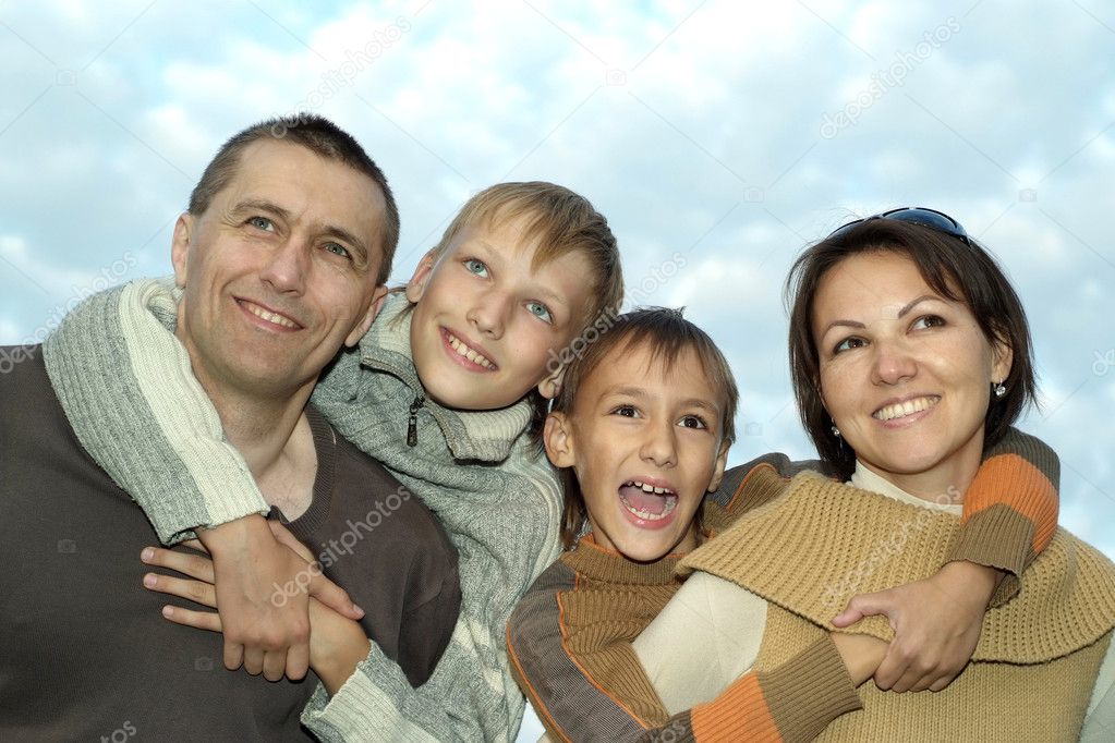 Happy parents and boys Stock Photo by ©aletia 29825267