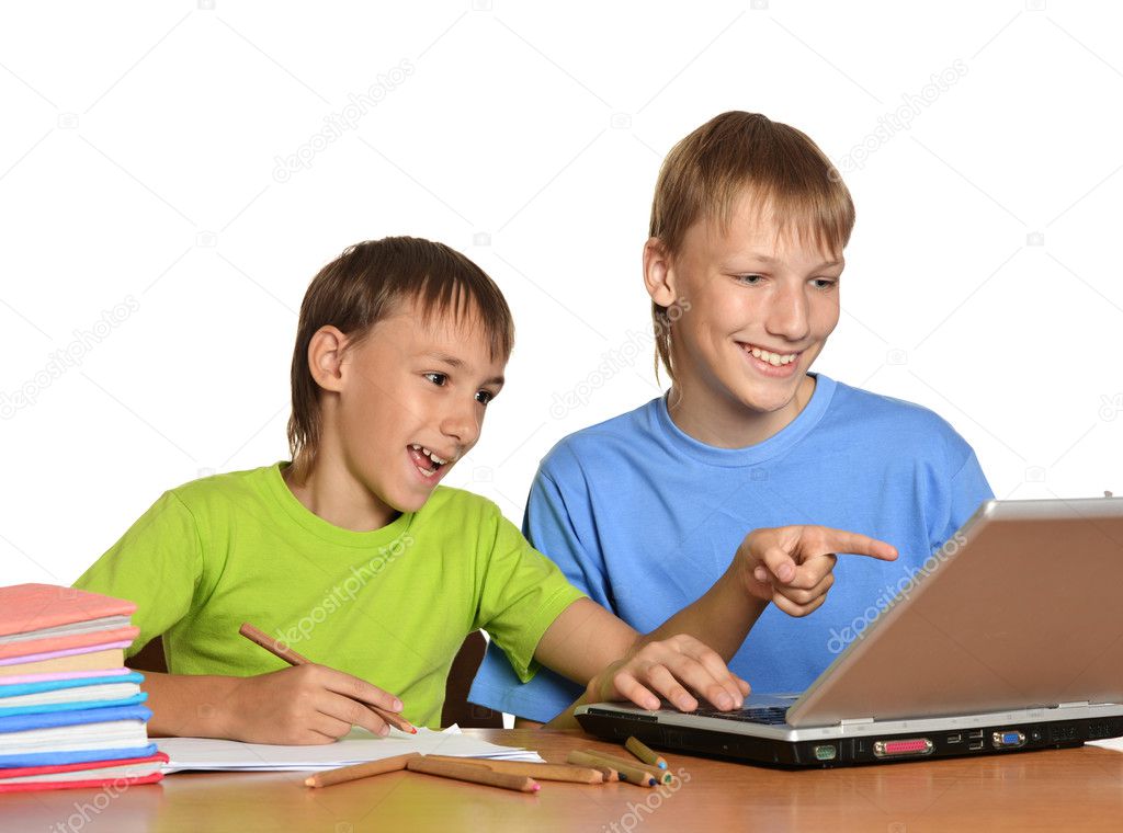 Two brothers with laptop doing homework — Stock Photo © aletia #30070685