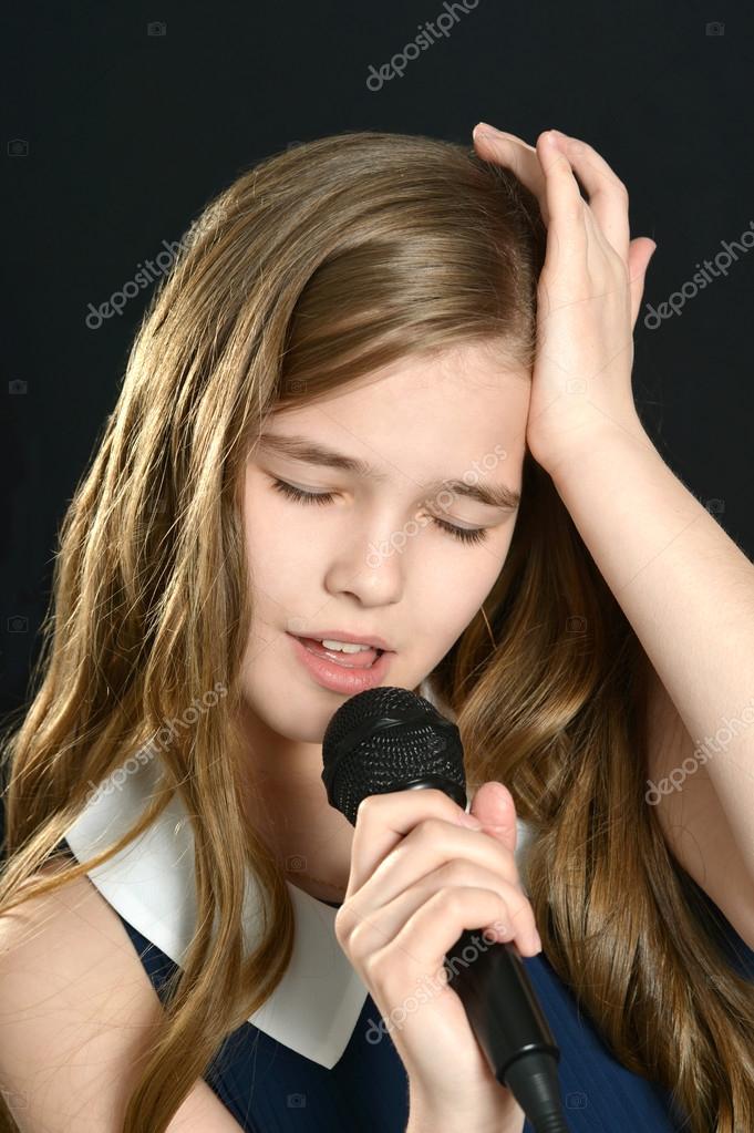 Cute girl singing Stock Photo by ©aletia 30736481