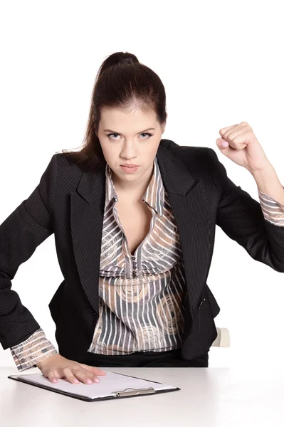 Angry secretary at table Stock Photo by ©aletia 36256193