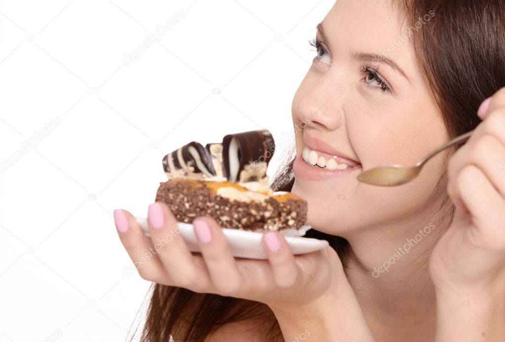 Beautiful young woman eating cake Stock Photo by ©aletia 36256227