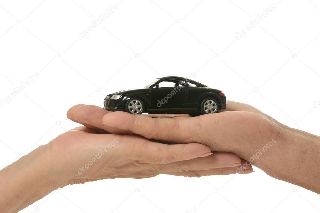 Hands with miniature car Stock Photo by ©aletia 43267319