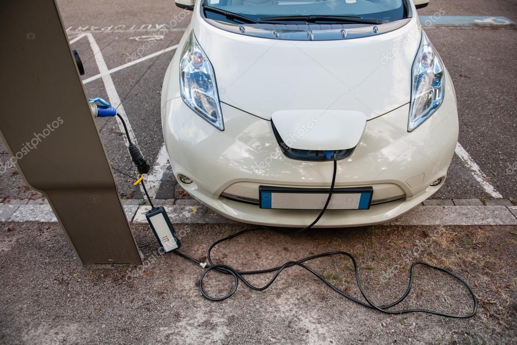 Electric car recharging — Stock Photo © ifeelstock #27124099