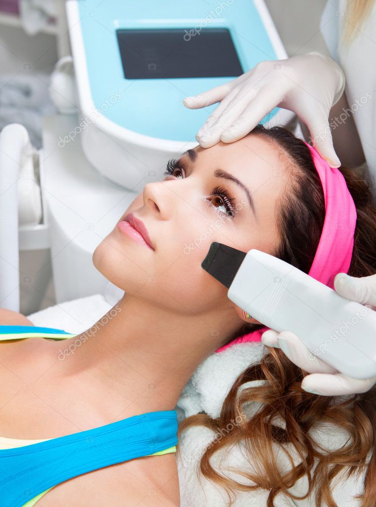 Woman getting laser face treatment — Stock Photo © NinaMalyna #38263349
