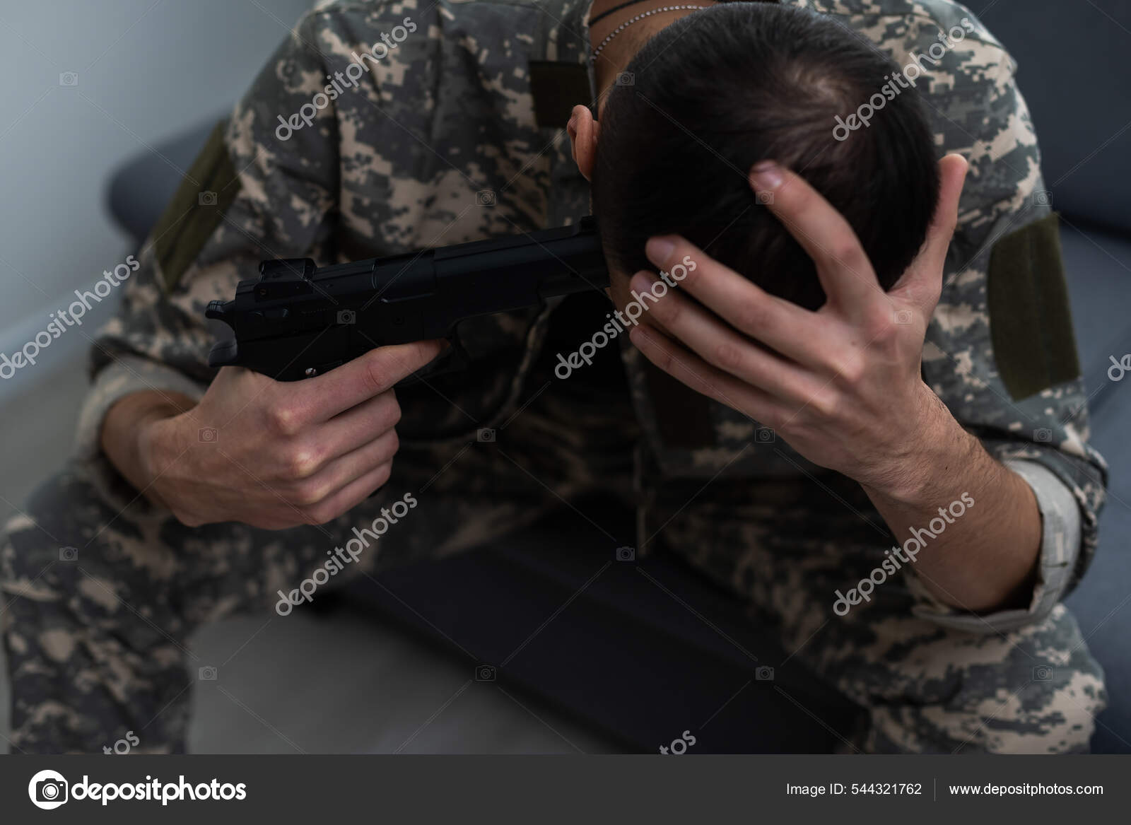 A army soldier takes aim with a pistol gun in his hands to the screen ...