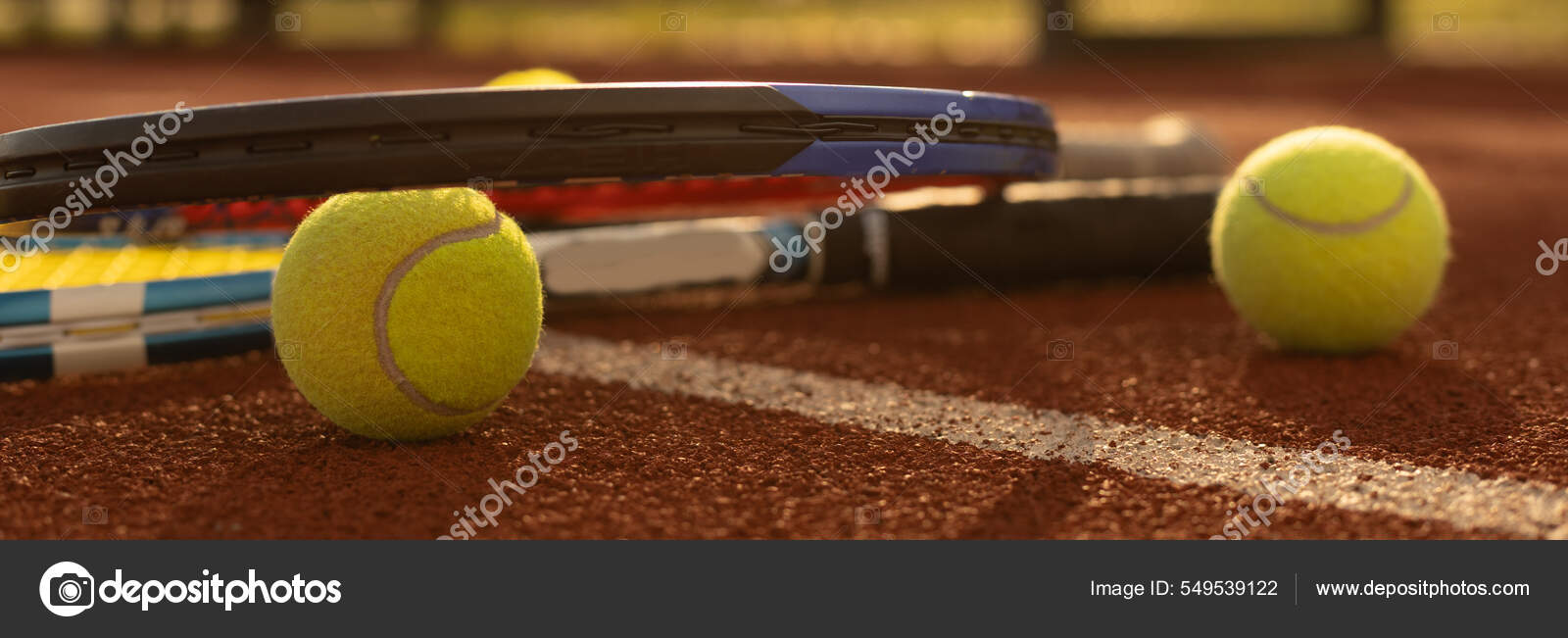 Close up view of two tennis rackets and balls on the tennis court ...