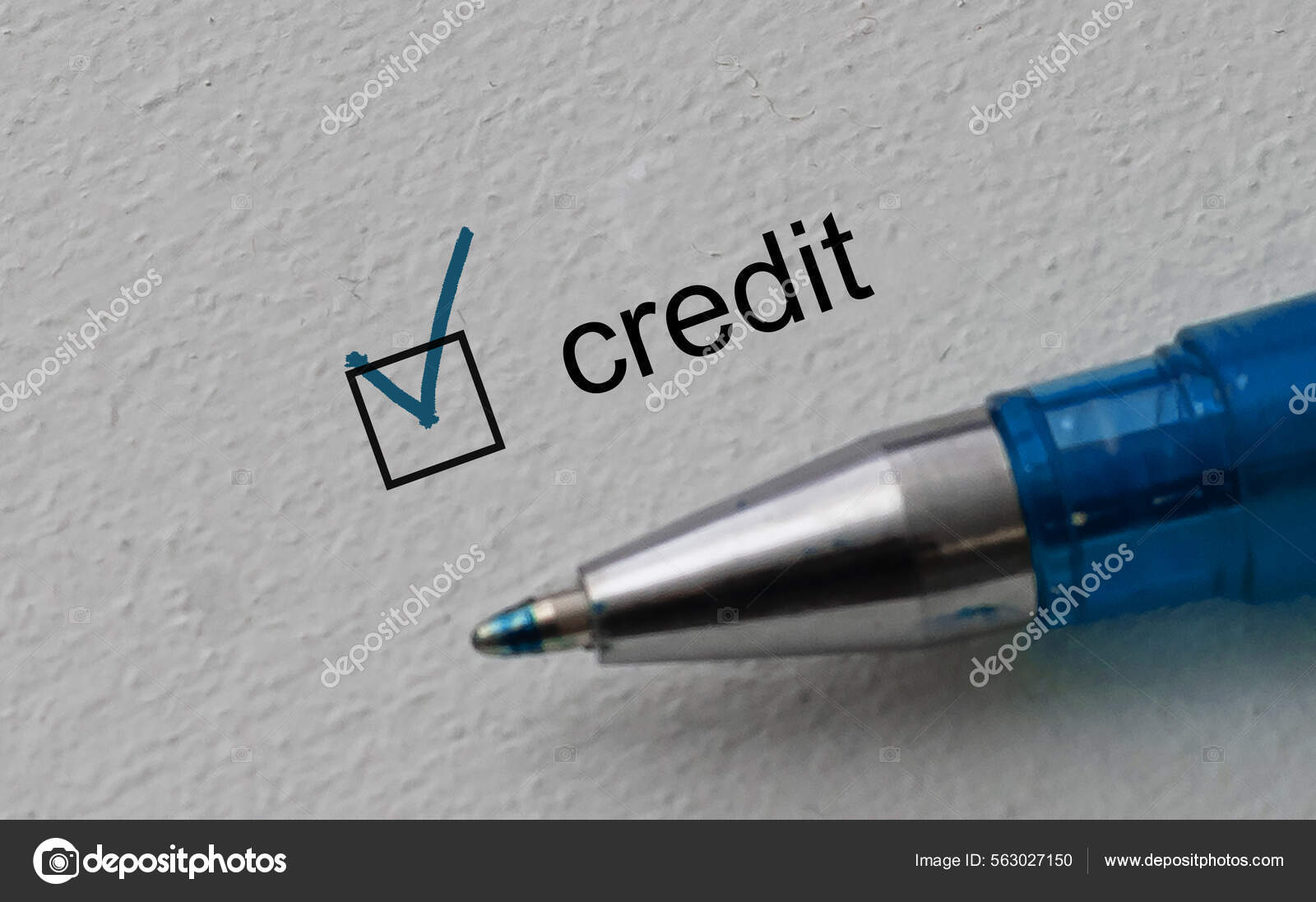 Check mark on the word credit and blue pen. Closeup, concept Stock ...