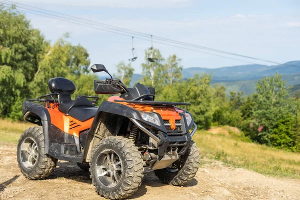 ATV Quad Bike in front of mountains landscape - Stock Image - Everypixel